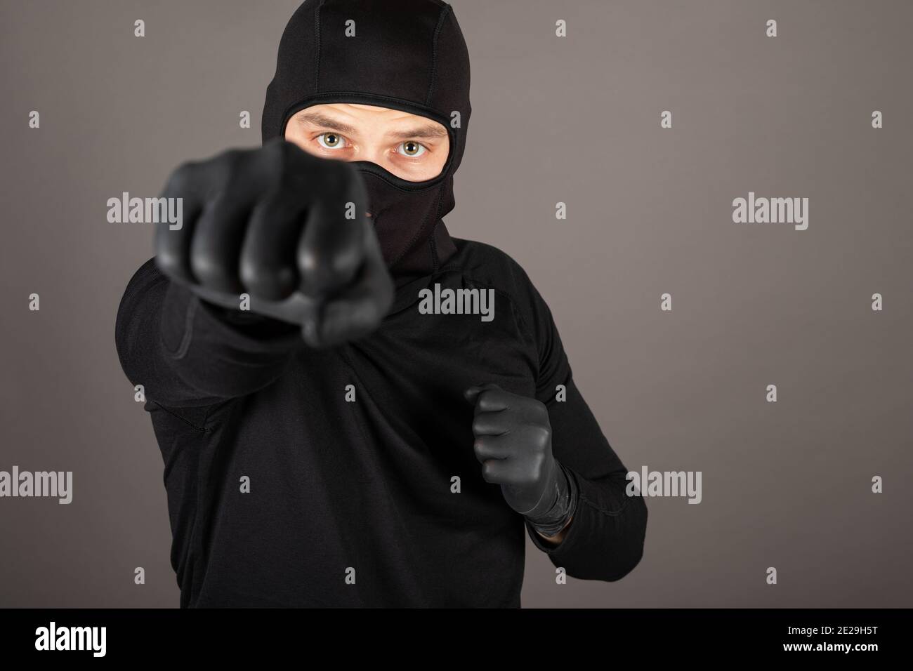Gangster wearing mask hi-res stock photography and images - Alamy