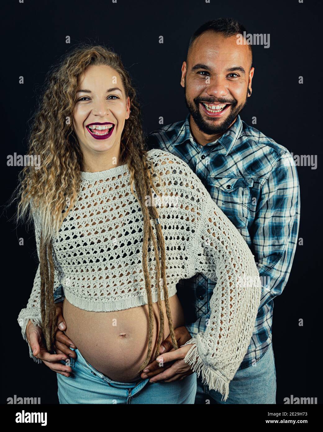 Vertical shot of a happy pregnant female and her husband Stock Photo ...