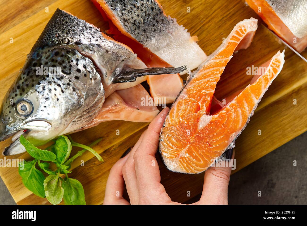 Cutting salmon fresh fish for dinner. diy cooking at home Stock Photo ...