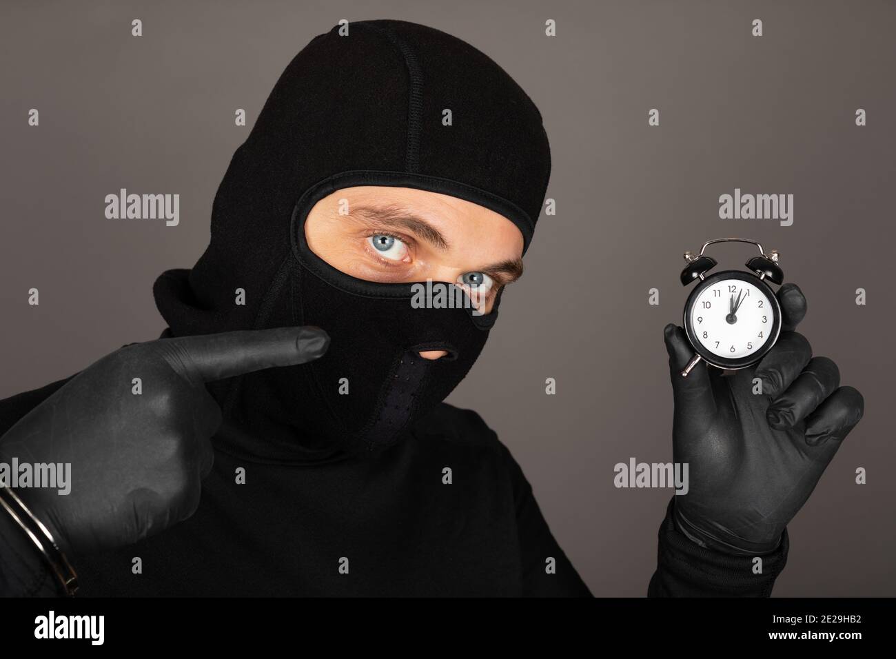 Picture of young man with black mask and outfit suspect of a robbery ...