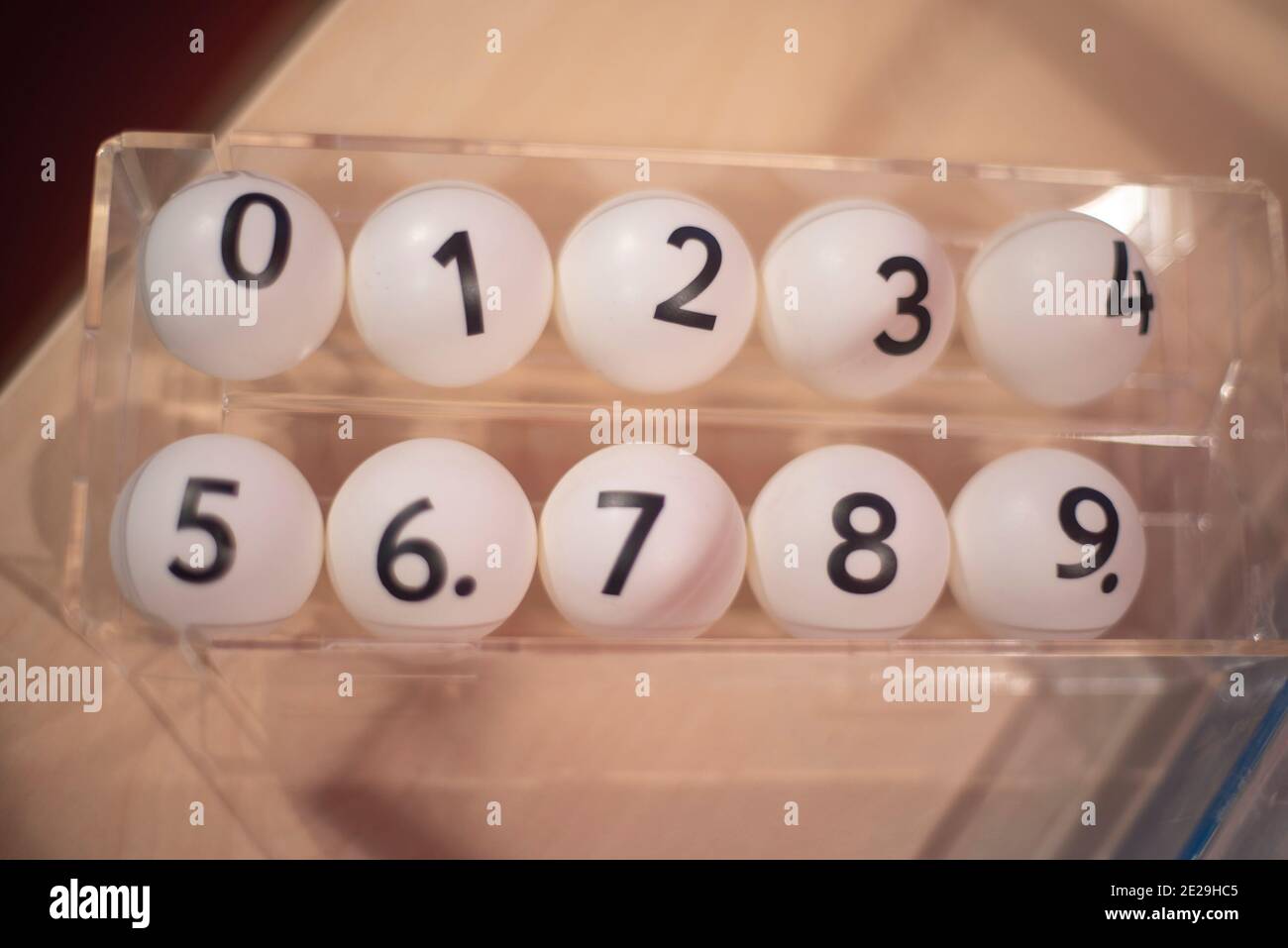 white balls with numbers for the game of lottery Stock Photo - Alamy