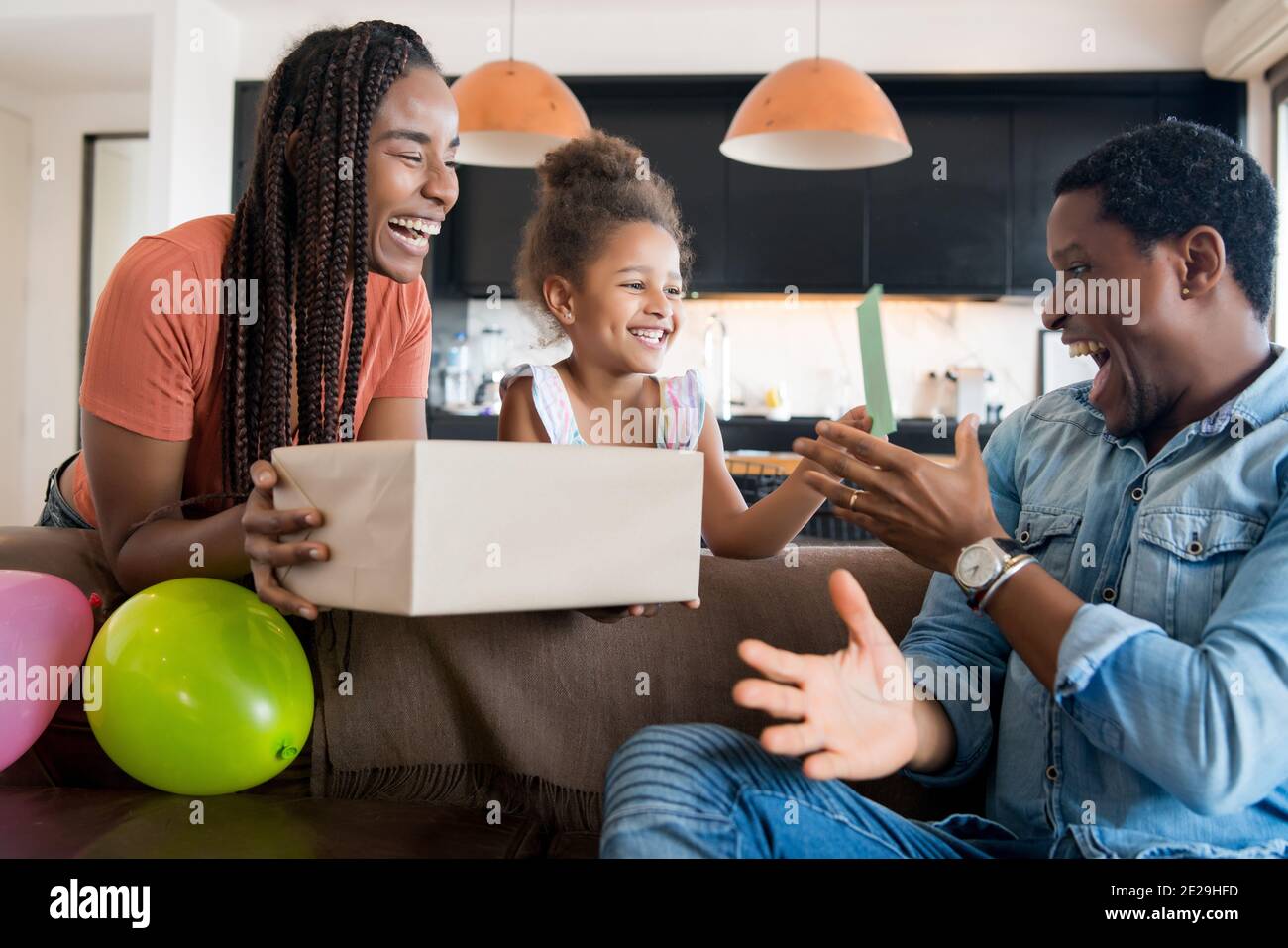 Father surprised with a gift from family Stock Photo - Alamy
