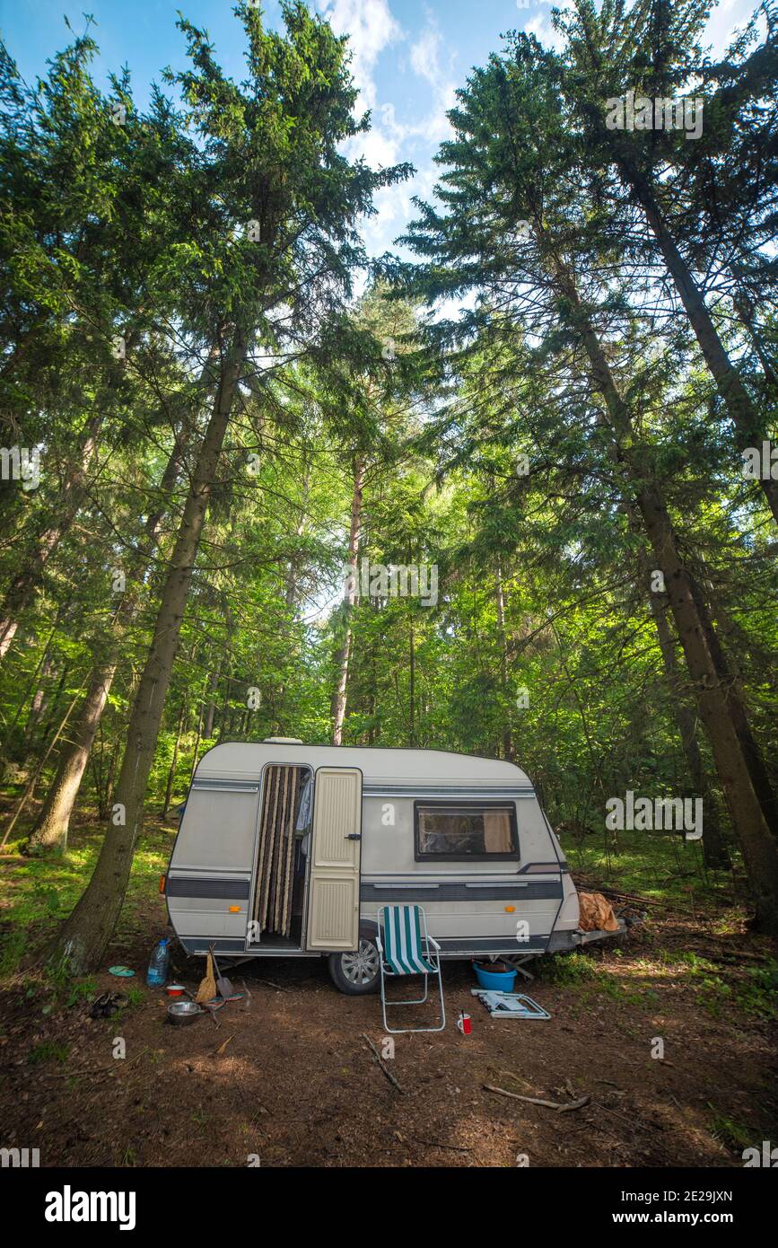 camper in the forest by the lake. Weekend trip Stock Photo - Alamy