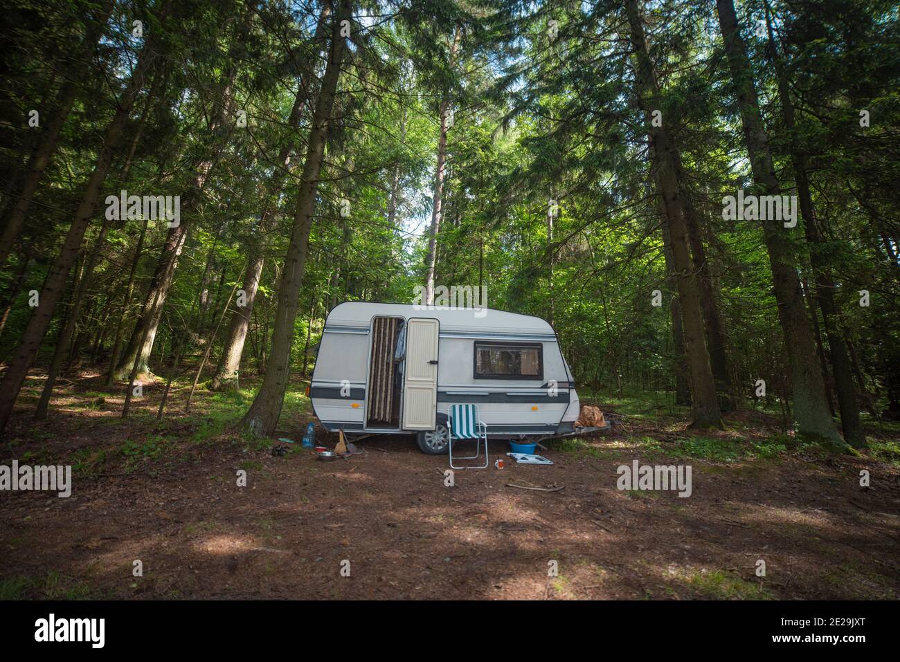 camper in the forest by the lake. Weekend trip Stock Photo - Alamy