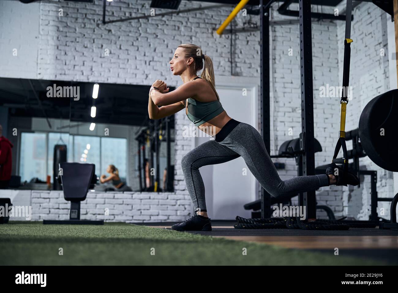 Athlete leaning forward staying on a single leg Stock Photo - Alamy