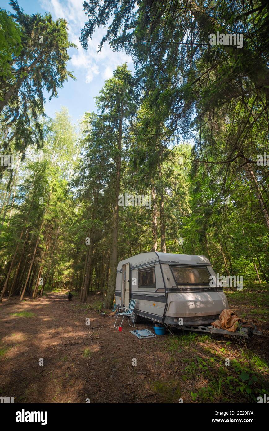 Camper in the forest hi-res stock photography and images - Alamy