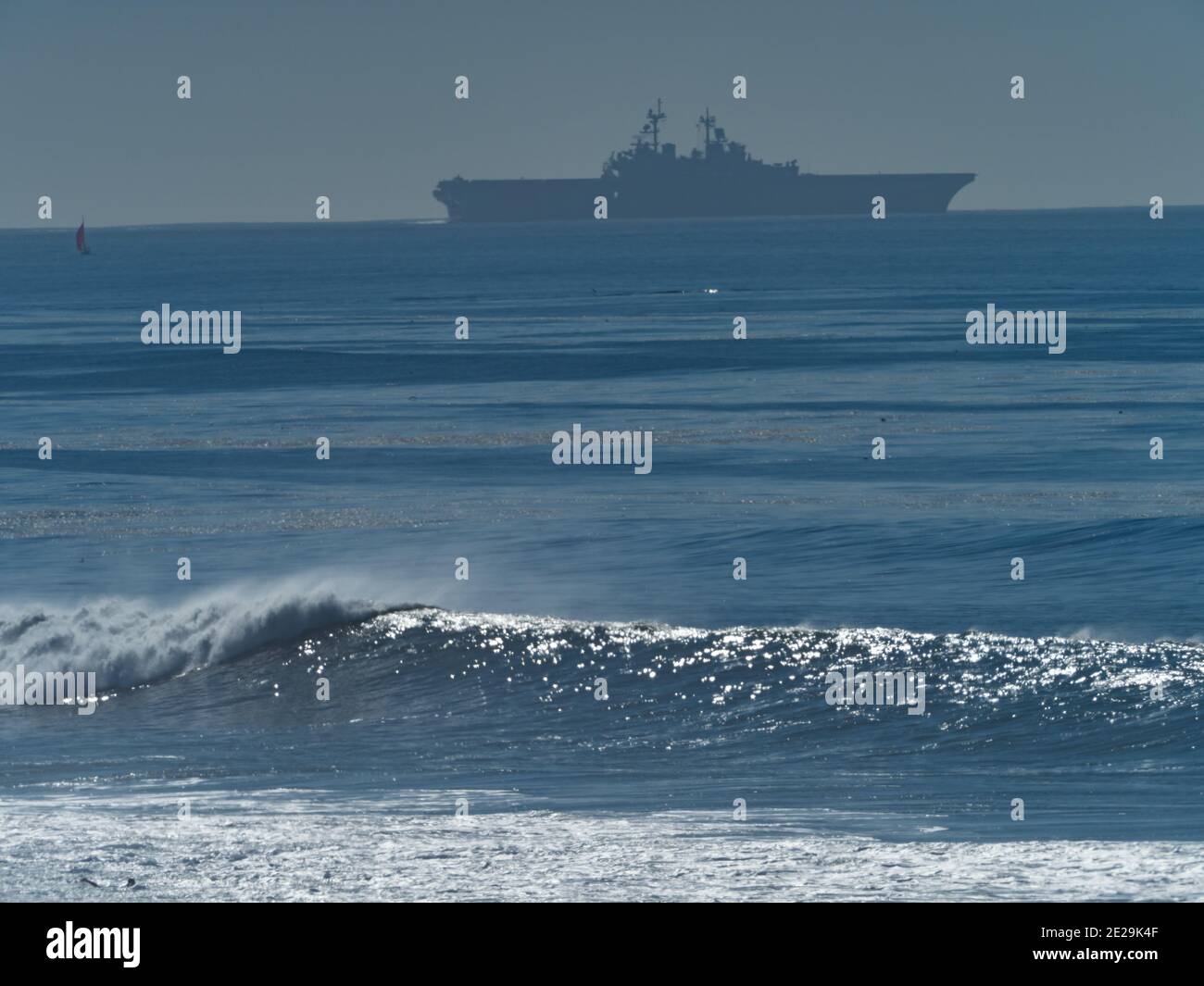 Huge waves and US Navy Aircraft carrier near Ocean Beach, San Diego ...