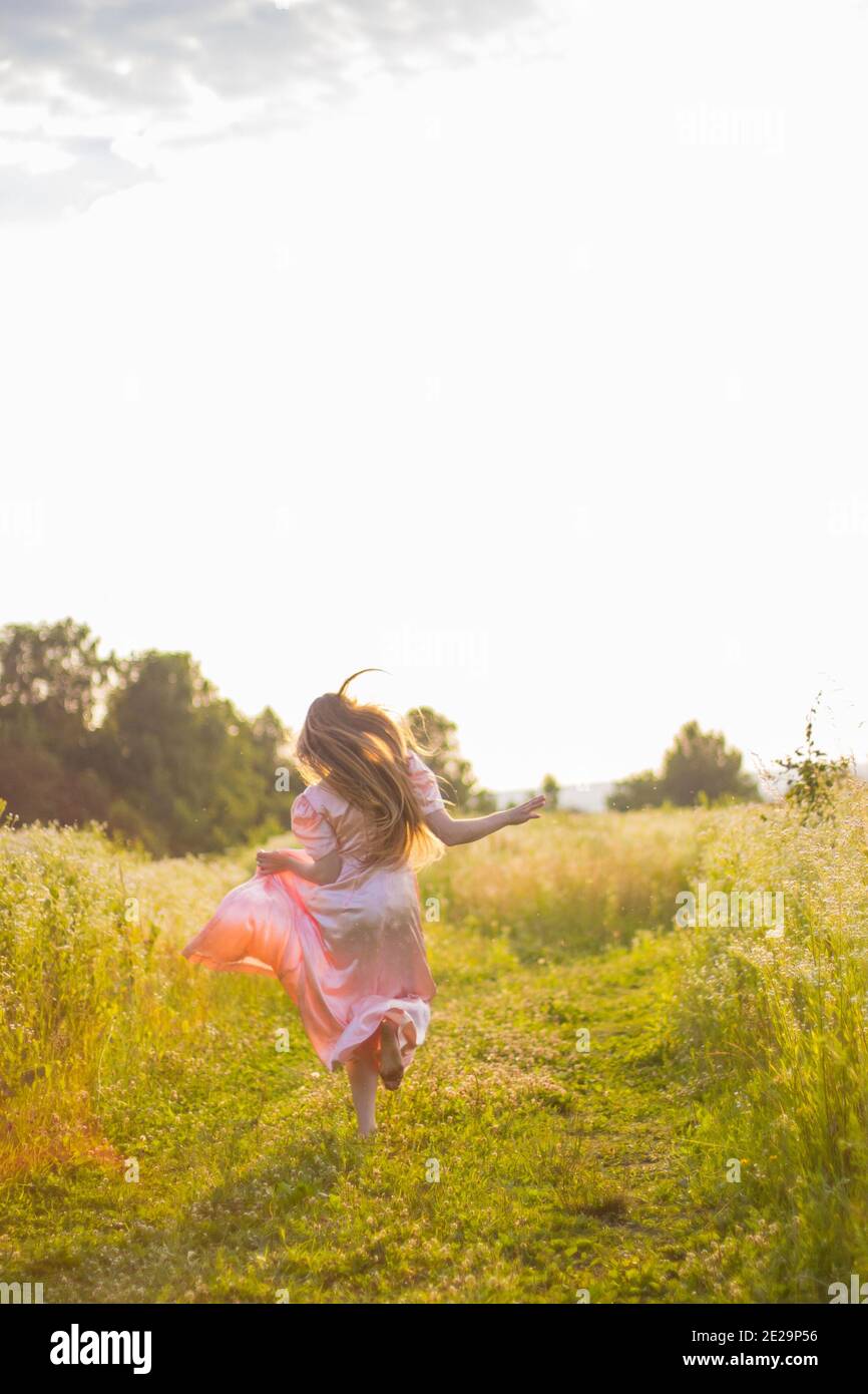 Girl Running In Flowers