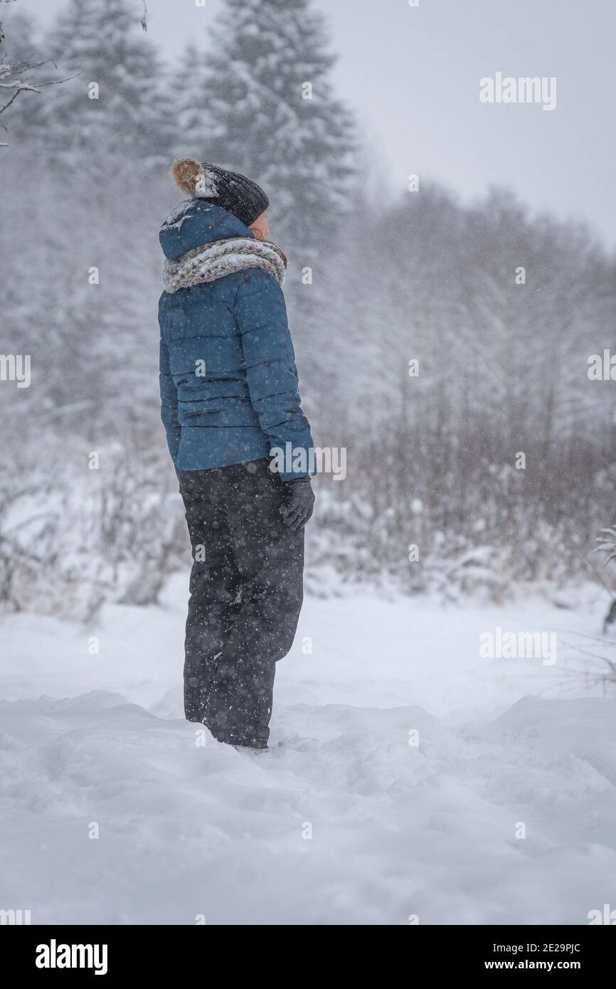 Girl walks in snowfall winter hi-res stock photography and images - Alamy