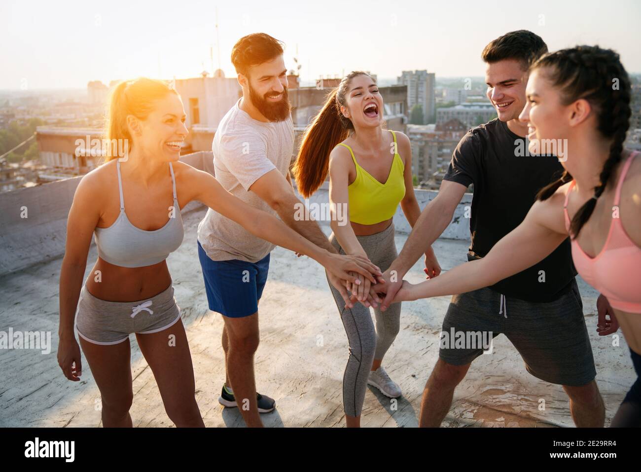 Group of fit healthy friends, people exercising together outdoor Stock ...