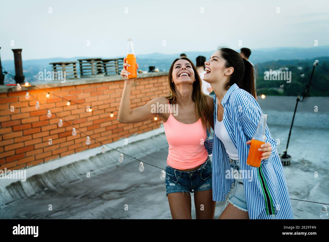 Party, holidays, celebration and friendship concept. Happy beautiful ...