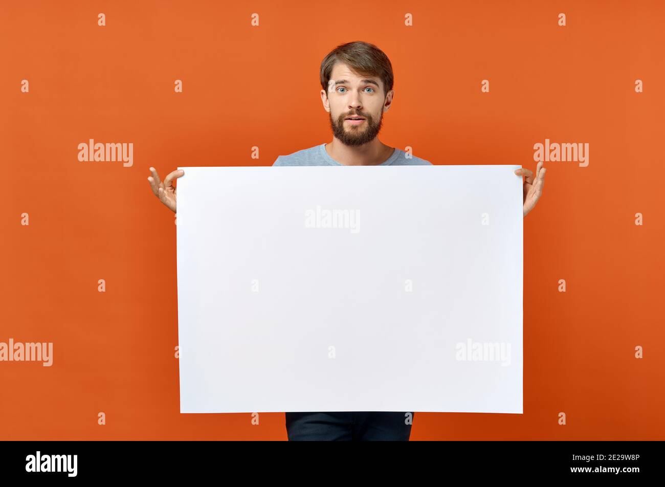 white sheet of paper ad advertisement man in the background orange ...