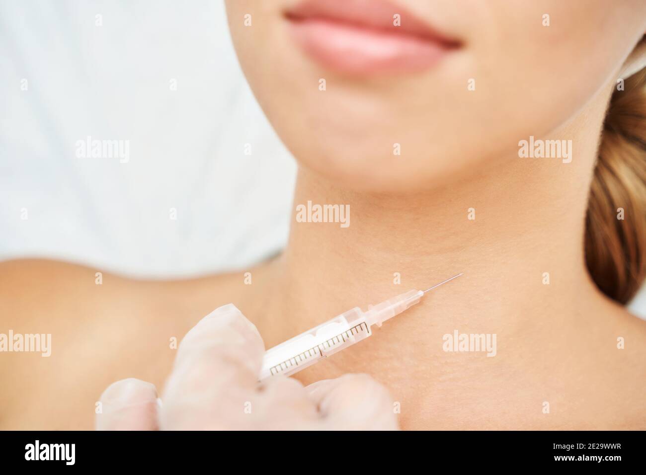 Neck injection at spa salon. Doctor hands. Closeup view. Pretty female ...