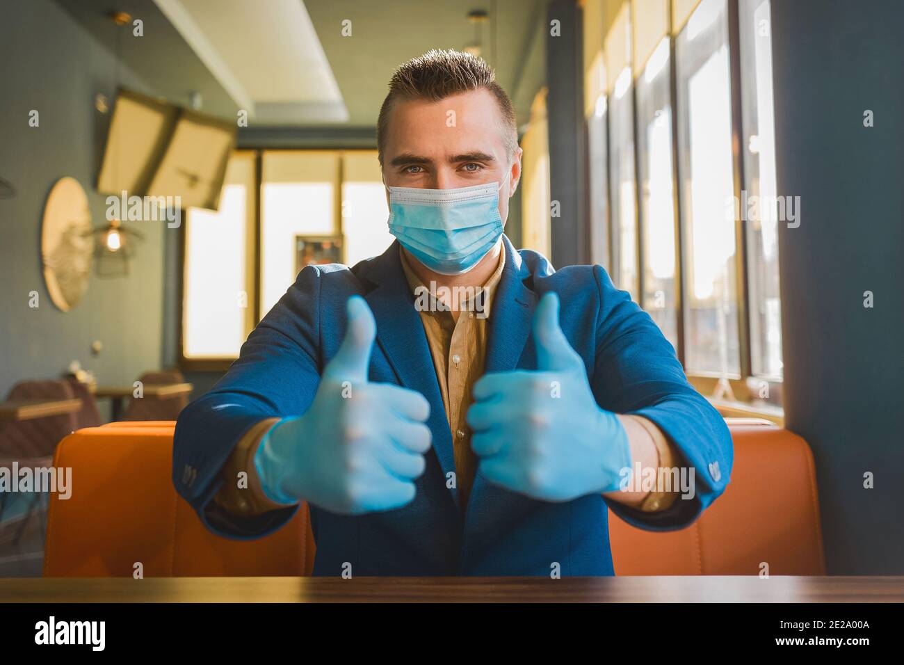 Businessman wearing thumbs up gloves hi-res stock photography and ...