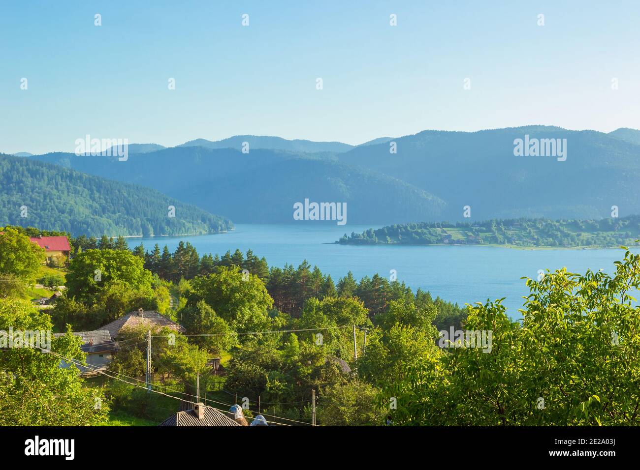 landscape of Lake Bicaz surrounded by mountains in Romania Stock Photo ...