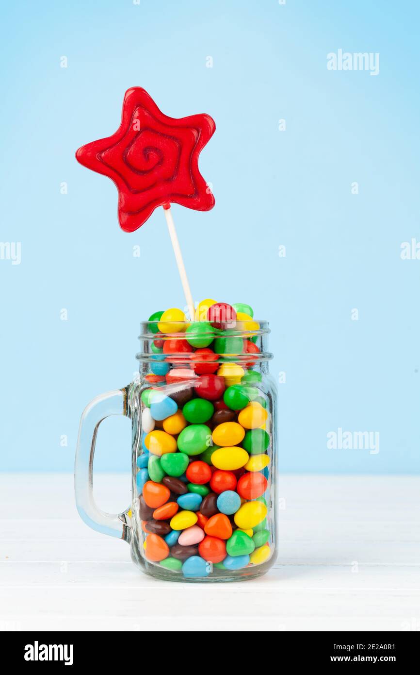 Various candy sweets and star lollipop Stock Photo - Alamy