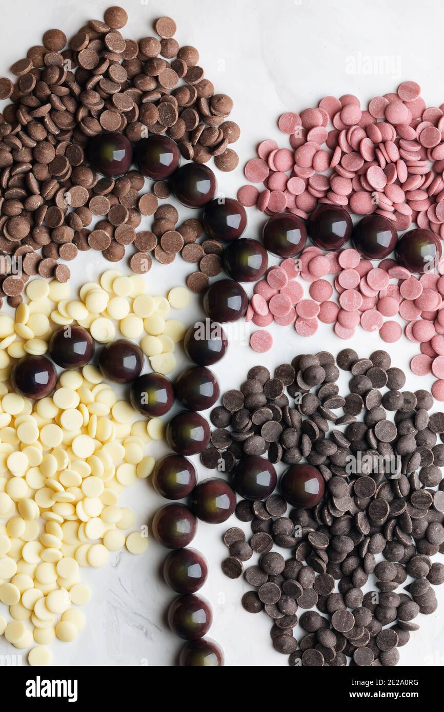 Assorted dark, milk, white, colored chocolate in callets and chocolate ...