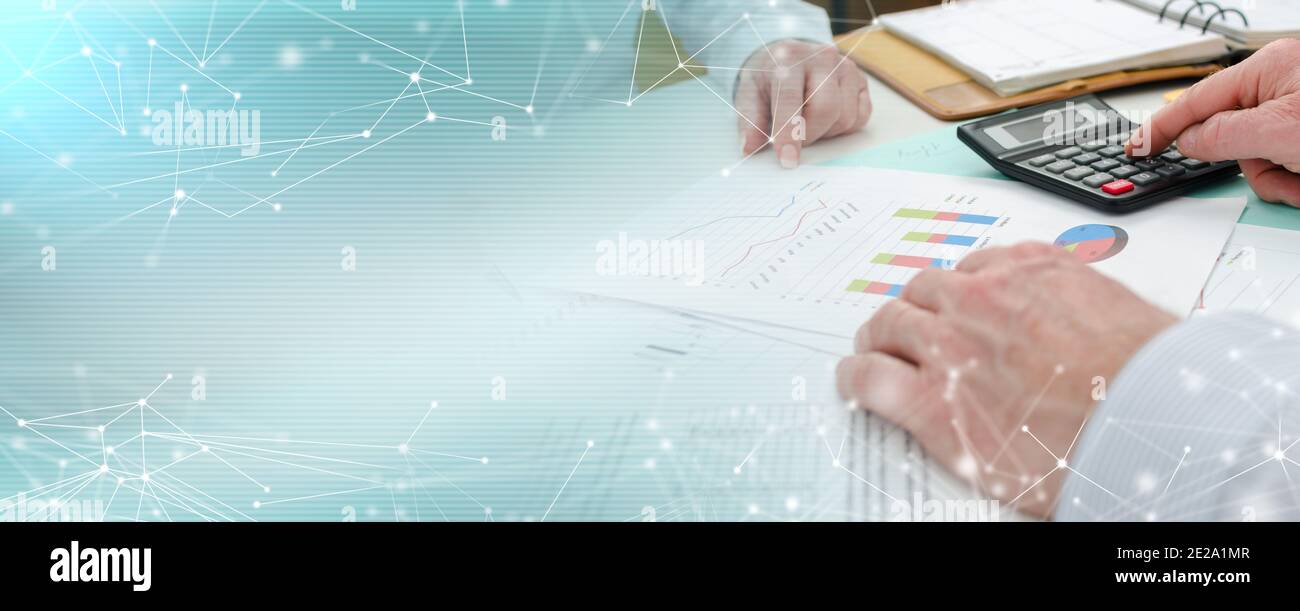 Business team working on financial graphs, top view; panoramic banner ...
