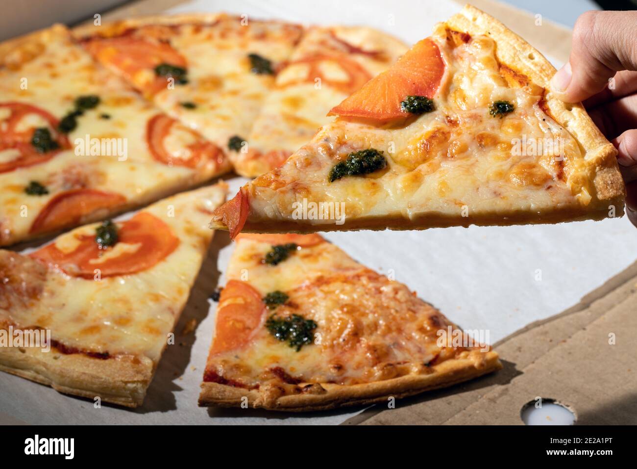 Pizza in hand hi-res stock photography and images - Alamy