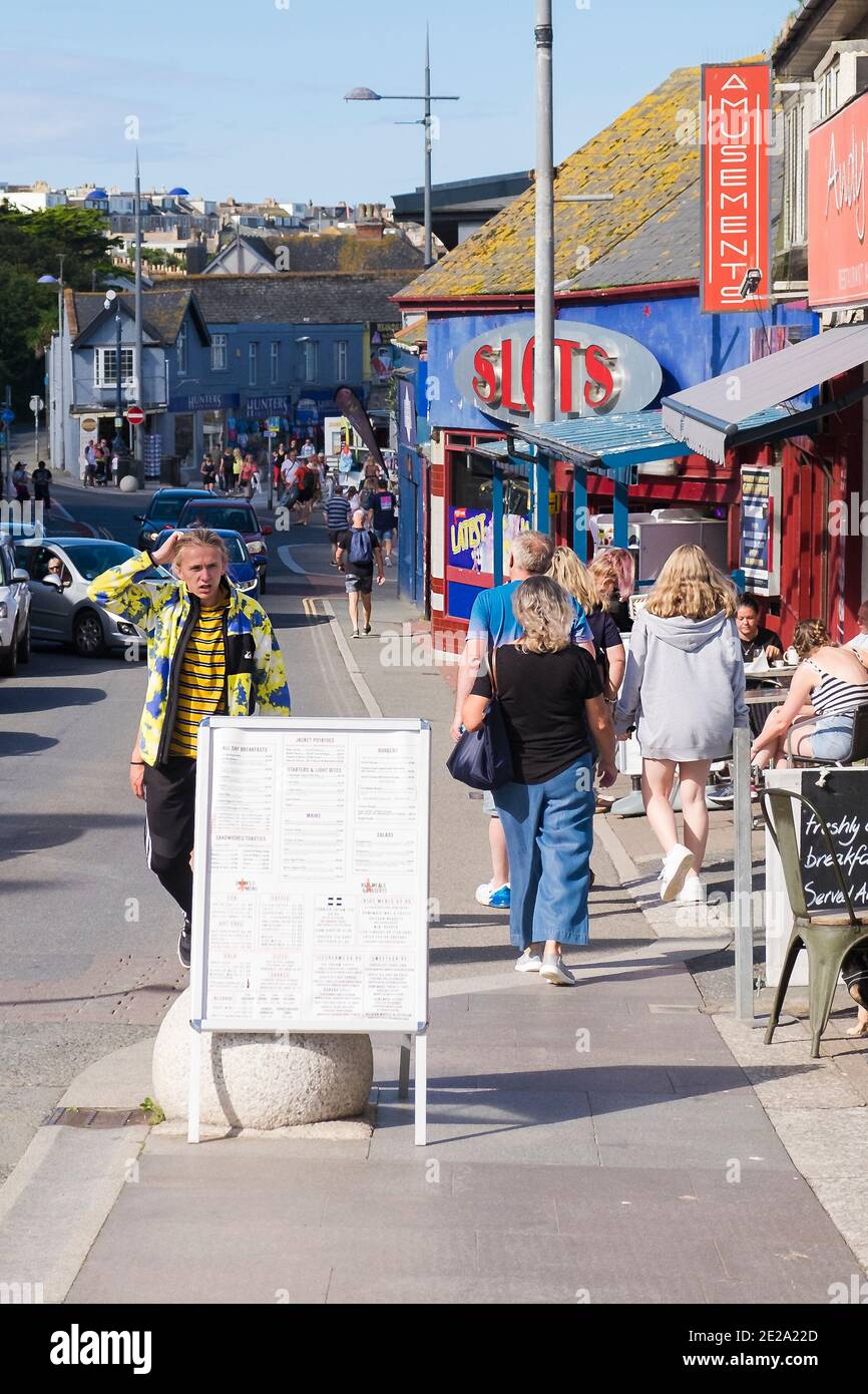 A general street view of holidaymakers in Newquay Town centre in ...
