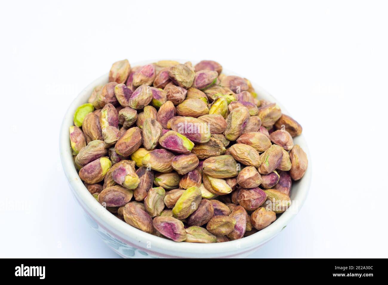 Fresh raw peeled pistachios isolated on white background Stock Photo ...