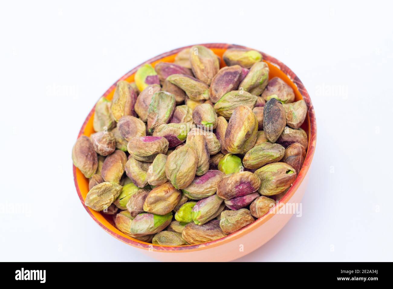 Fresh raw peeled pistachios isolated on white background Stock Photo ...