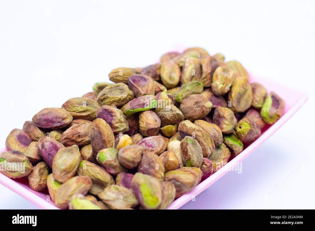 Fresh raw peeled pistachios isolated on white background Stock Photo ...