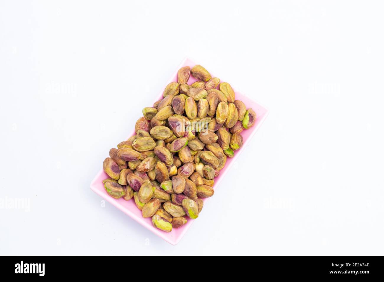 Fresh raw peeled pistachios isolated on white background Stock Photo ...