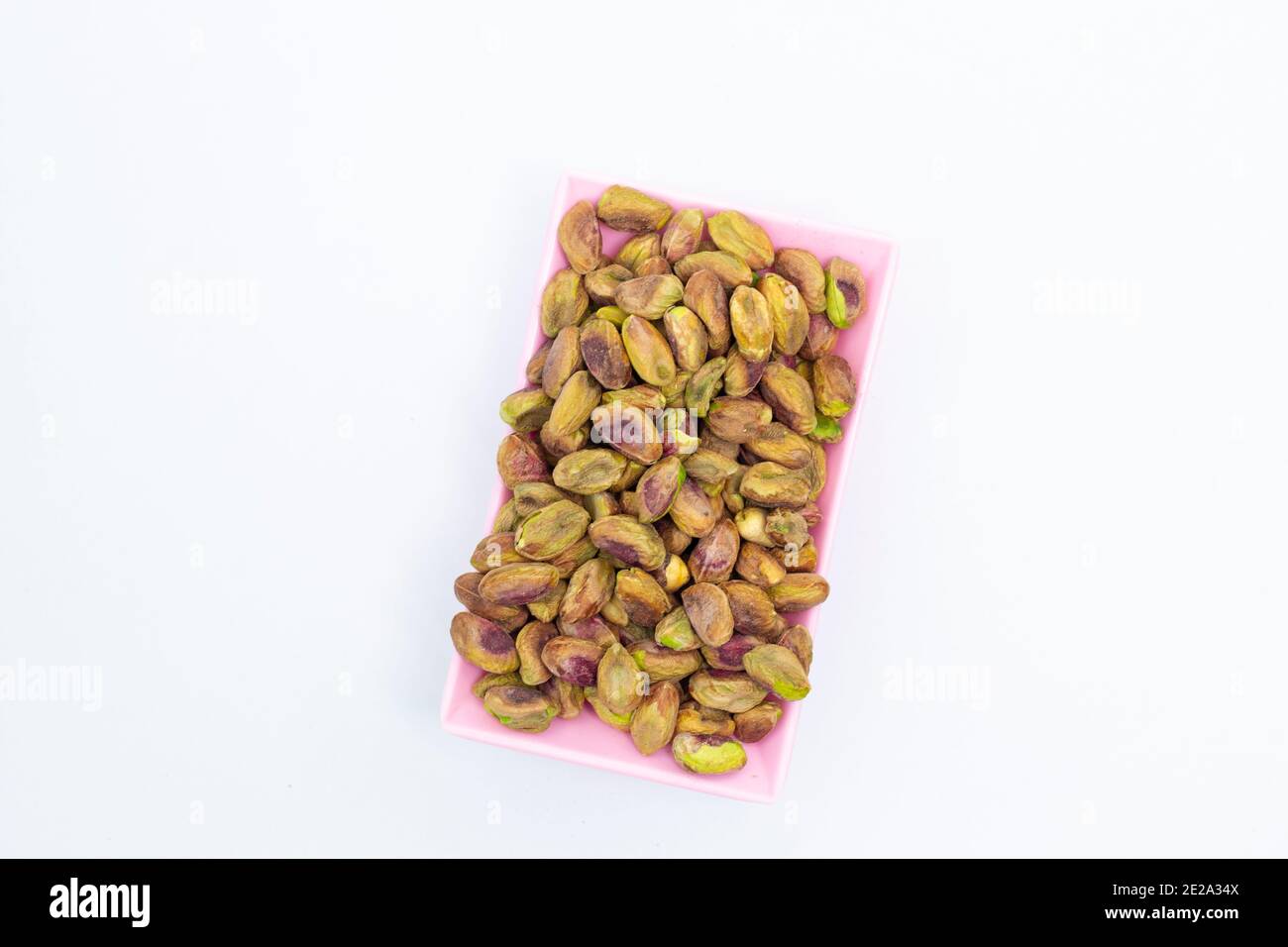 Fresh raw peeled pistachios isolated on white background Stock Photo ...