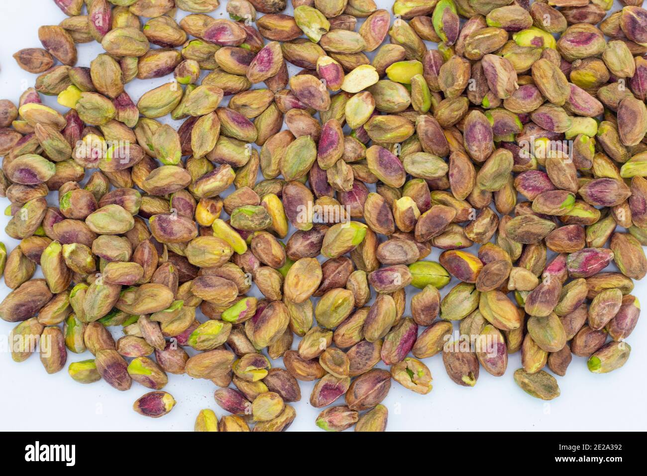 Fresh raw peeled pistachios isolated on white background Stock Photo ...
