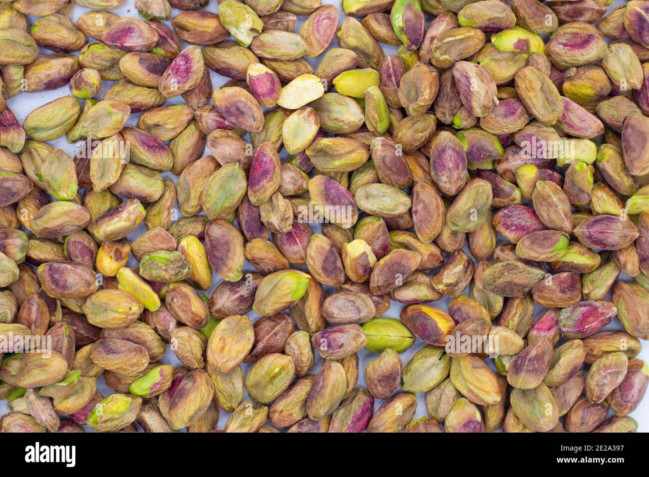 Fresh raw peeled pistachios isolated on white background Stock Photo ...
