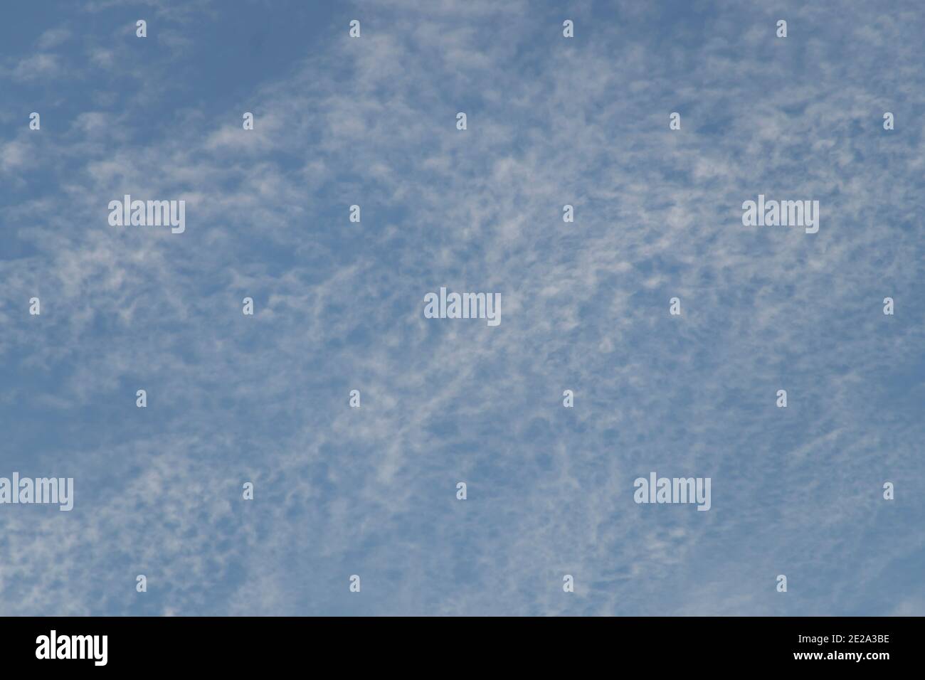 High altitide cirrocumulus clouds. Thin, feathery, white cloudlets in a ...