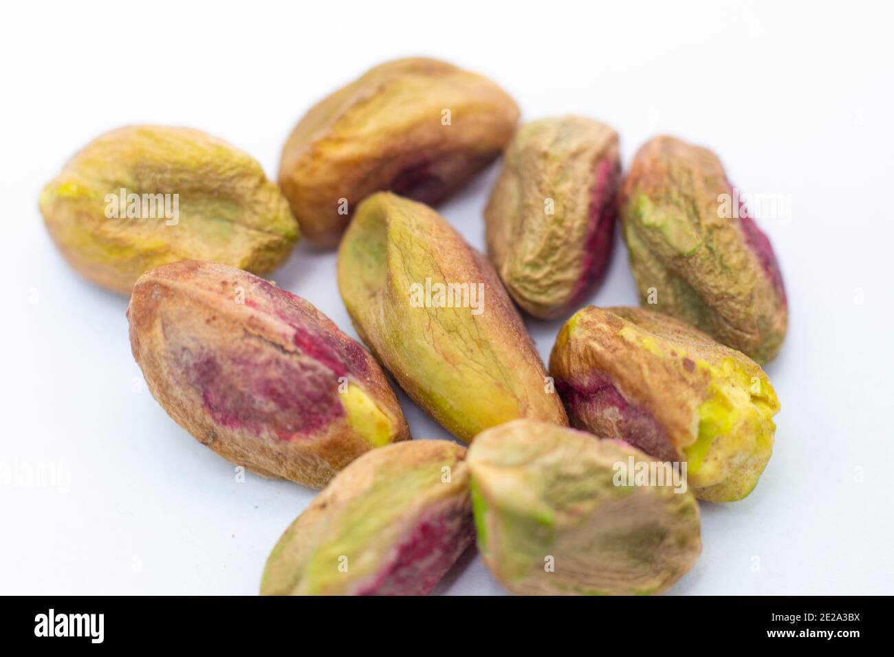 Fresh raw peeled pistachios isolated on white background Stock Photo ...