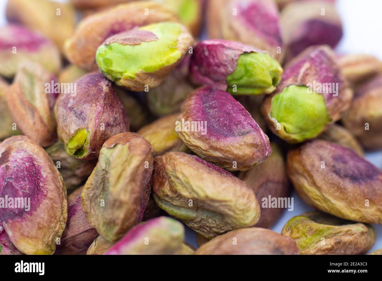 Fresh raw peeled pistachios isolated on white background Stock Photo ...