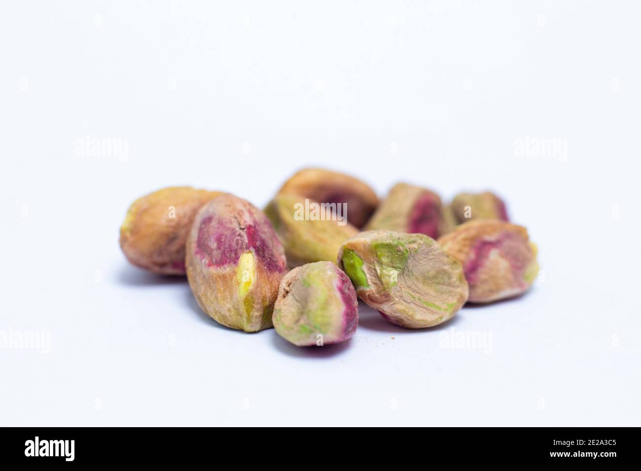Fresh raw peeled pistachios isolated on white background Stock Photo ...