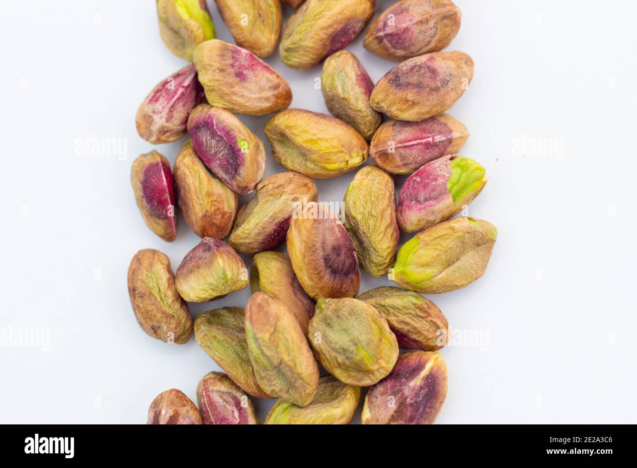 Fresh raw peeled pistachios isolated on white background Stock Photo ...