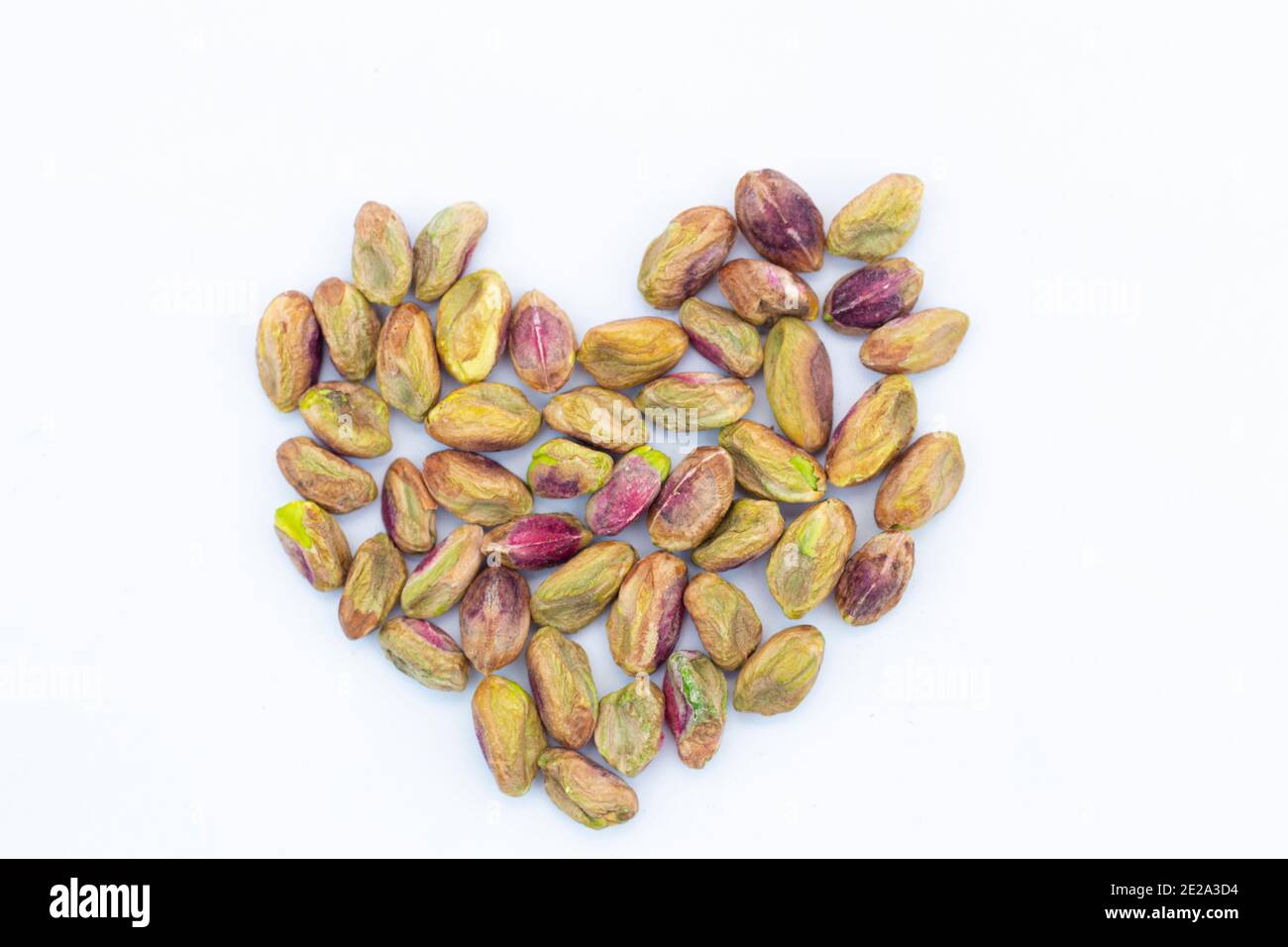 Fresh raw peeled pistachios isolated on white background Stock Photo ...