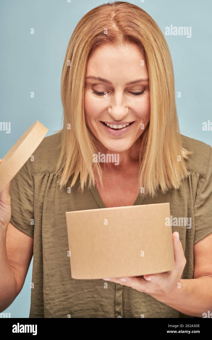 Lady opening box new hi-res stock photography and images - Alamy