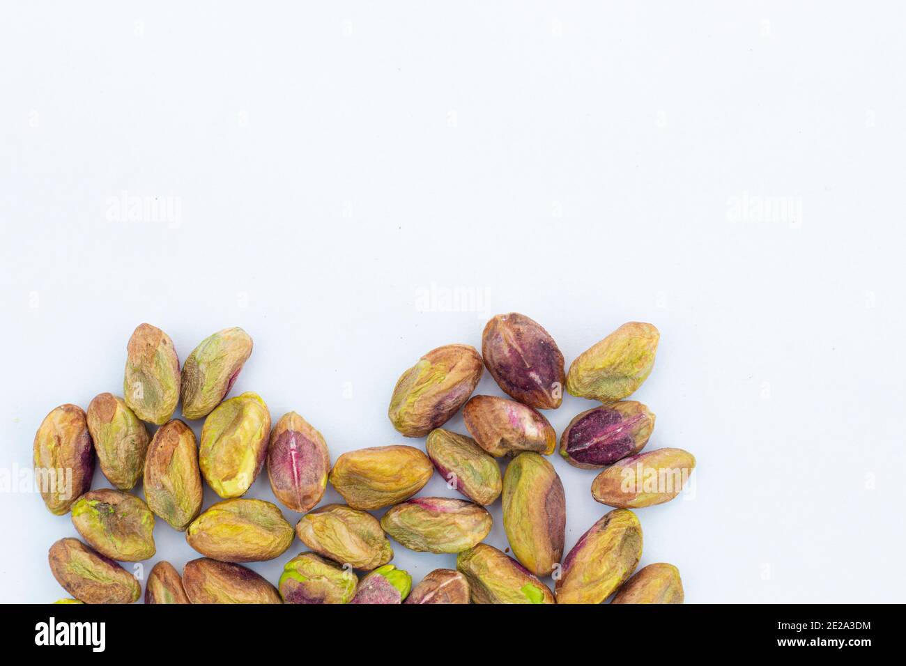Fresh raw peeled pistachios isolated on white background Stock Photo ...
