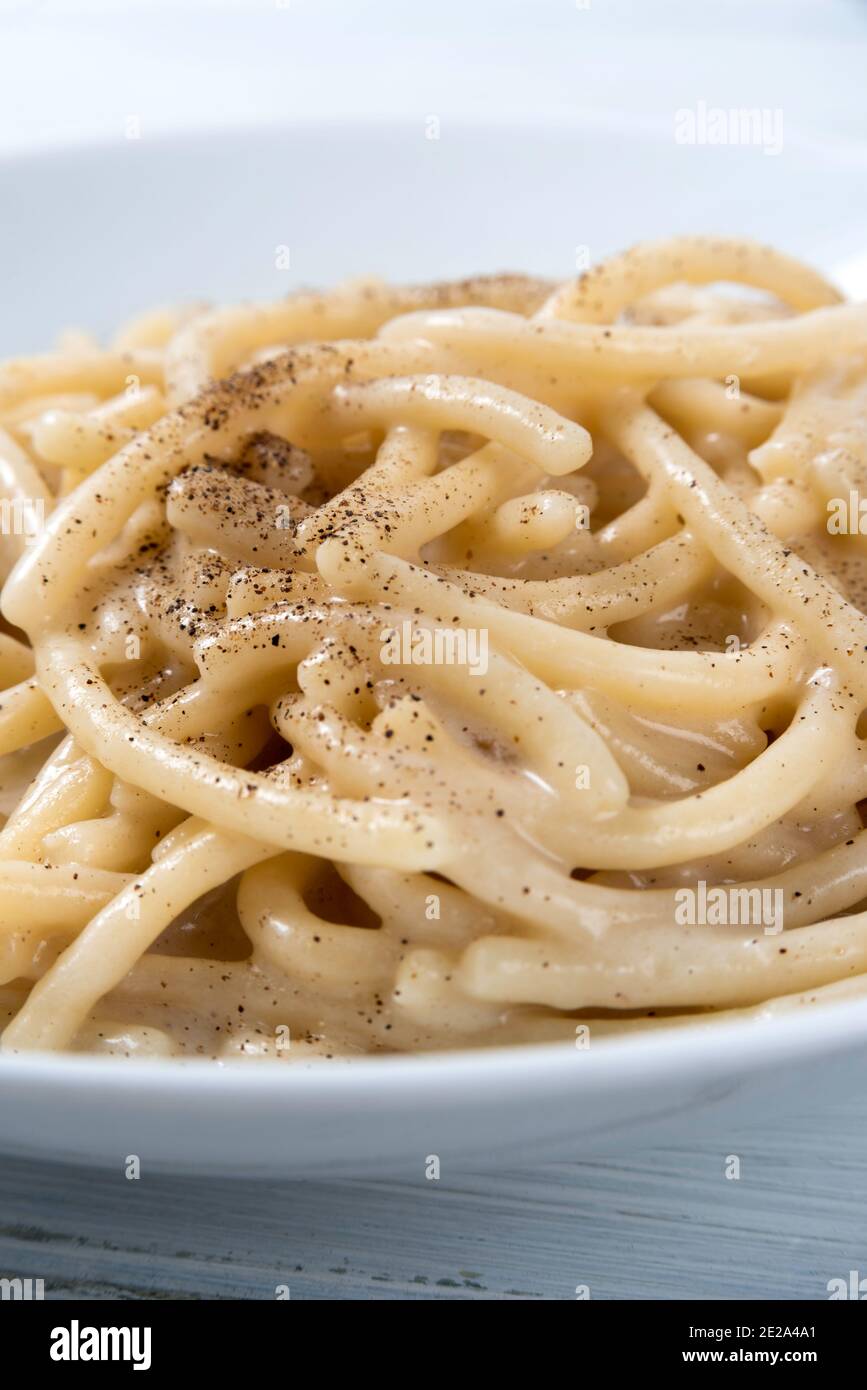 Dish of delicious cacio & pepe spaghetti, a typical recipe of italian ...
