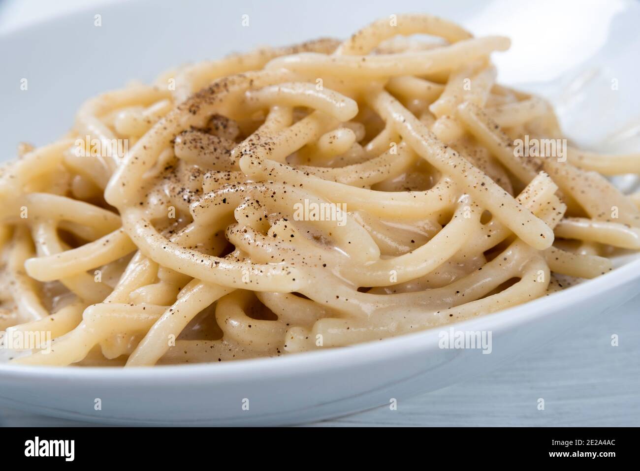 Dish of delicious cacio & pepe spaghetti, a typical recipe of italian ...