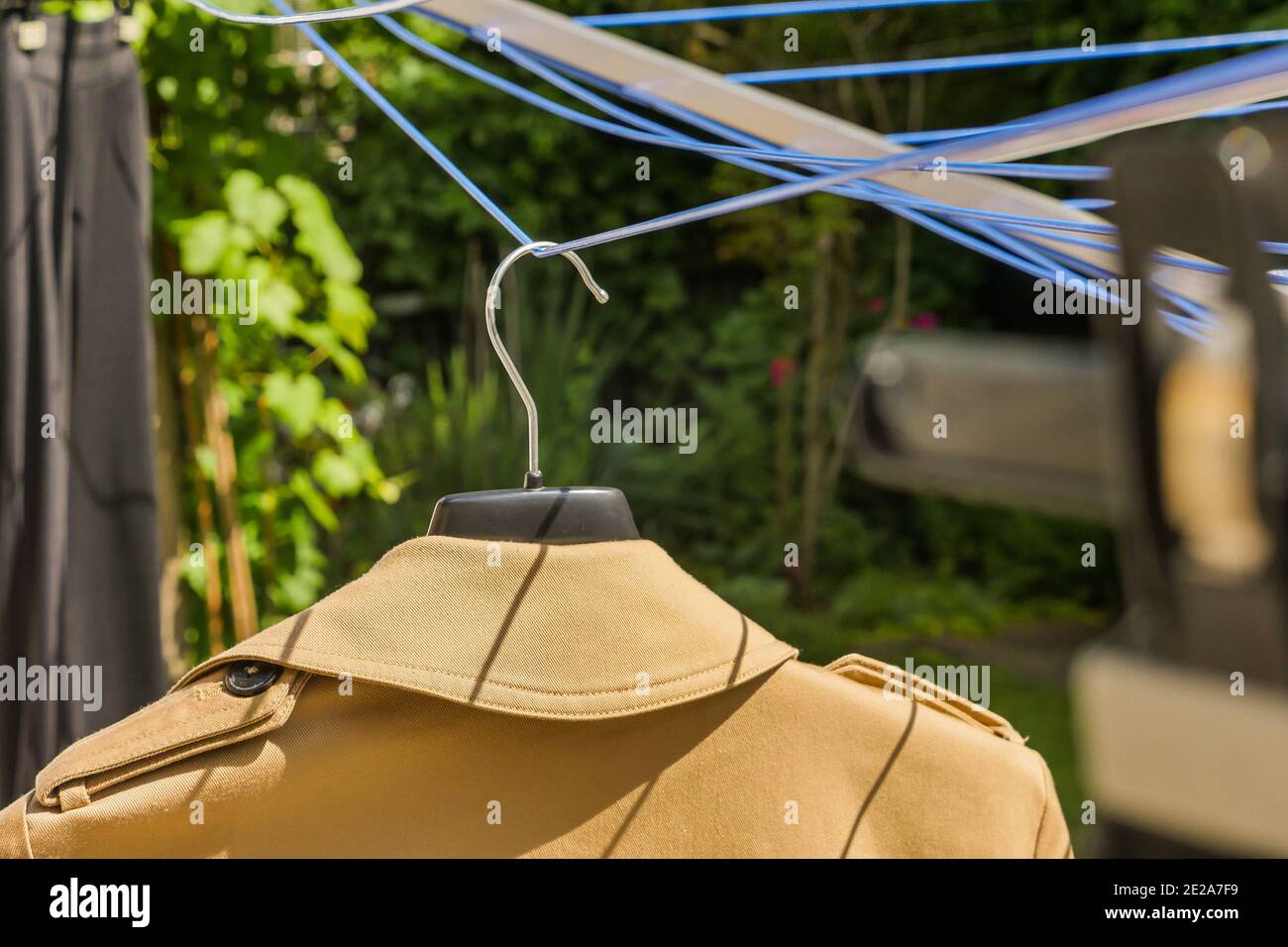 Coat hanging hi-res stock photography and images - Alamy