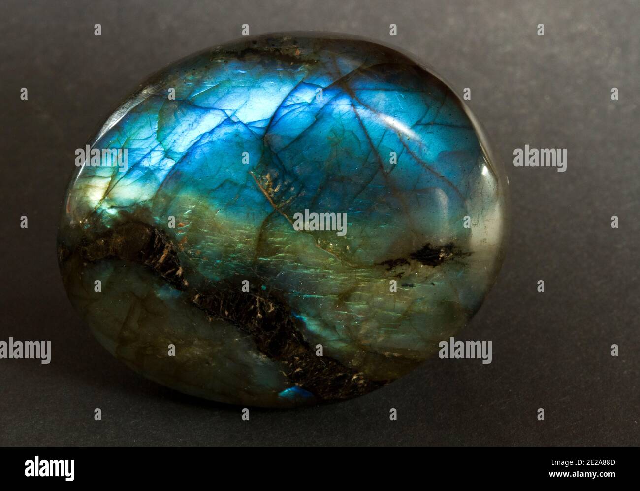 The beautiful iridescent colour of the mineral Labradorite. The ...