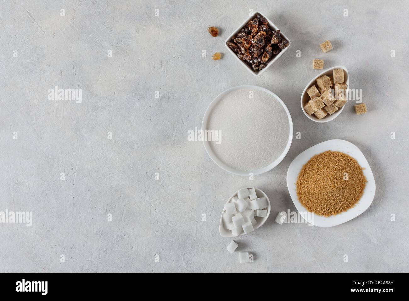 Various kinds of sugar. Different white and brown sugar in assortment ...