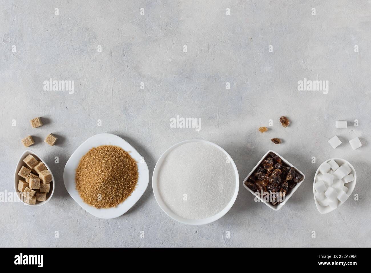 Various kinds of sugar. Different white and brown sugar in assortment ...