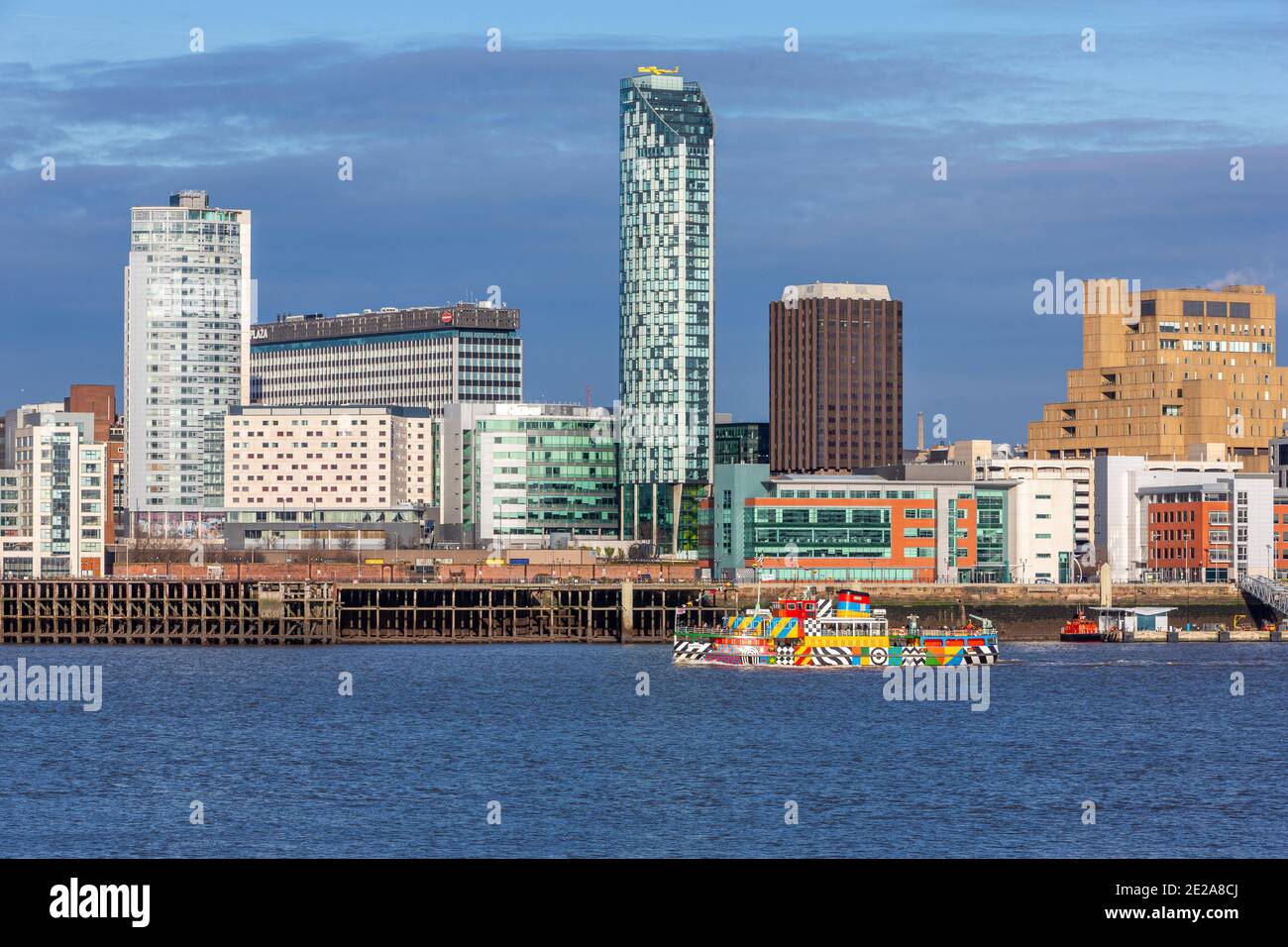 A Mersey Ferry in front of the Liverpool waterfront buildings Stock ...