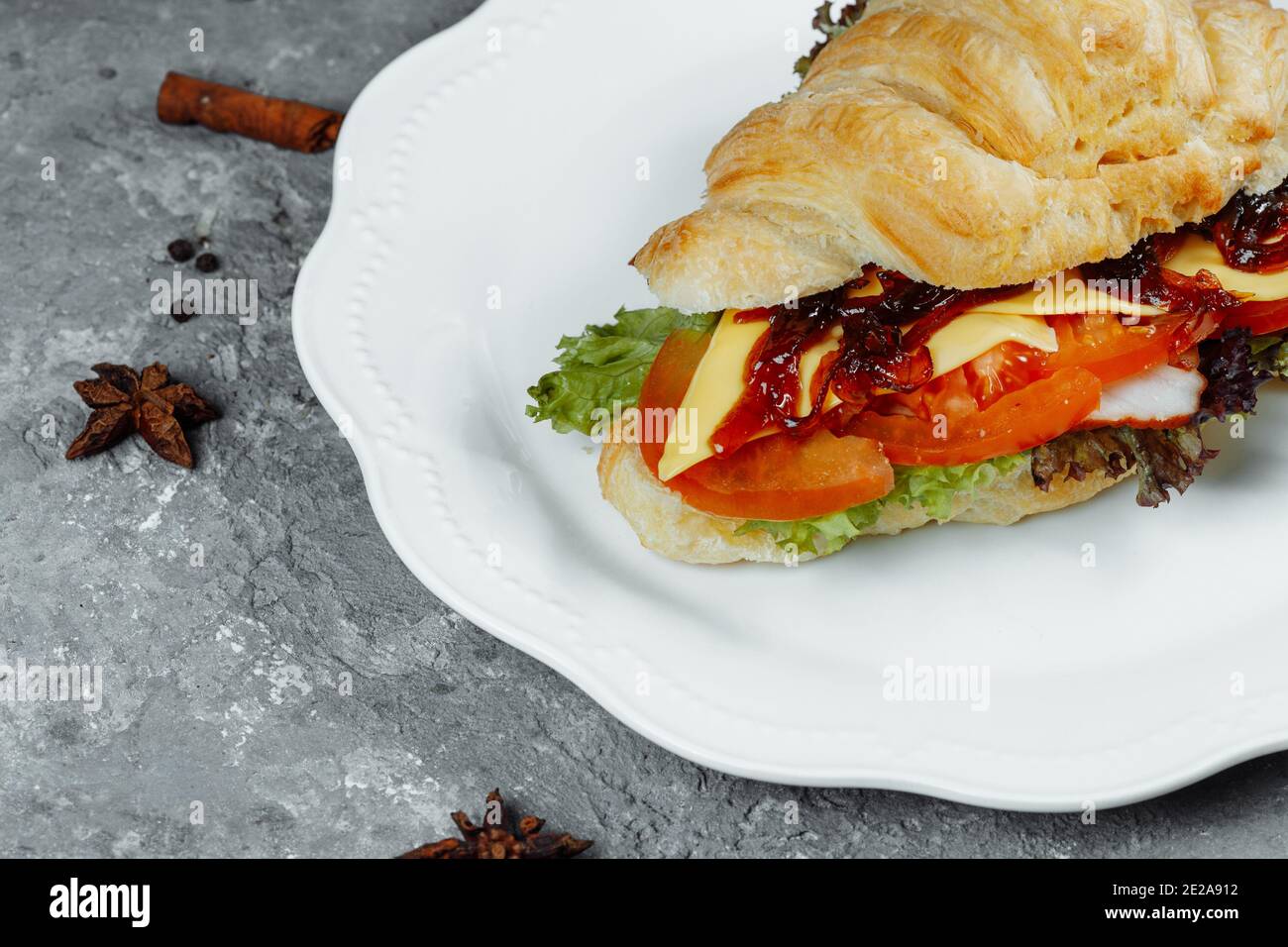Delicious ham and cheddar cheese croissant with salad Stock Photo - Alamy