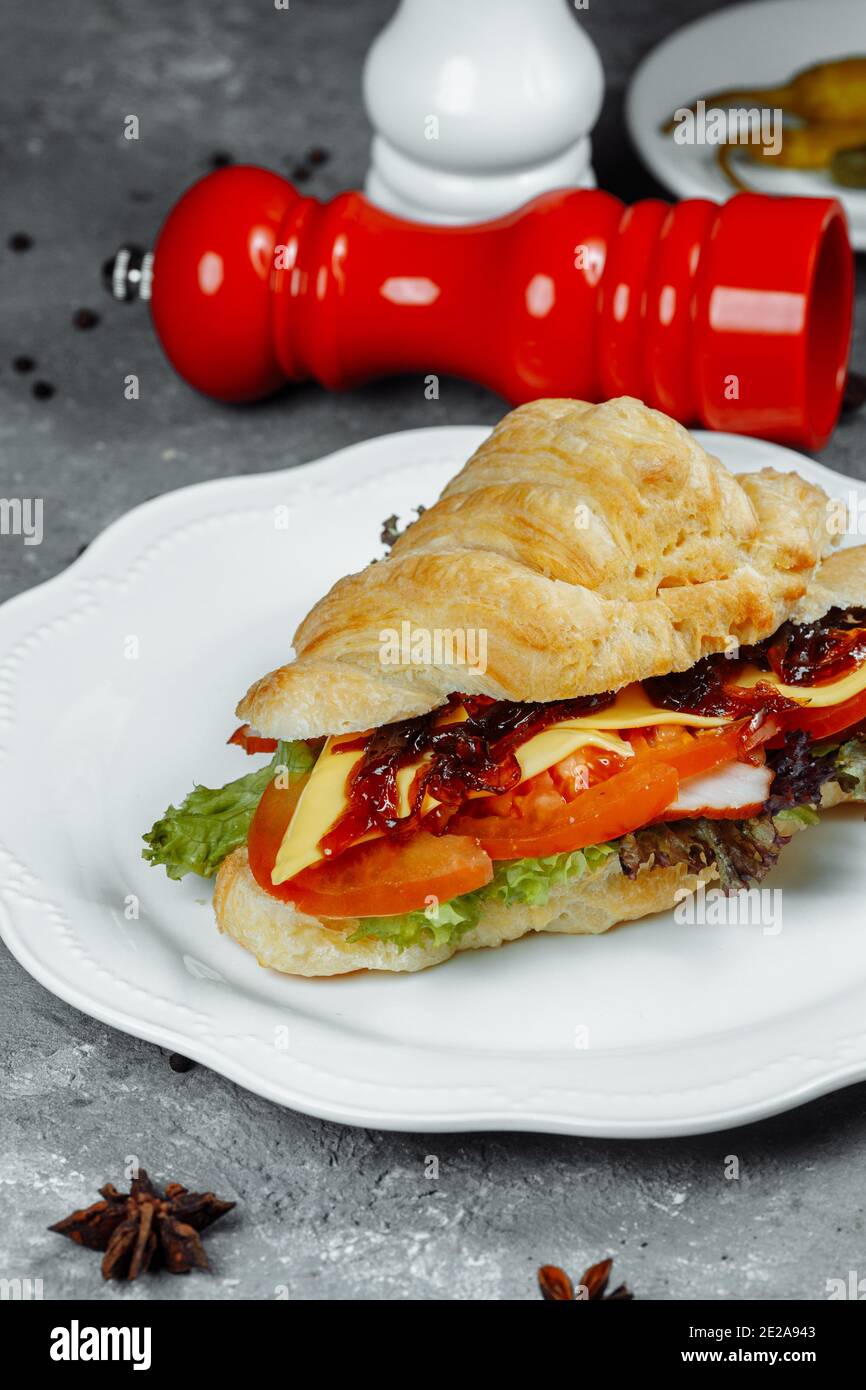 Delicious ham and cheddar cheese croissant with salad Stock Photo - Alamy