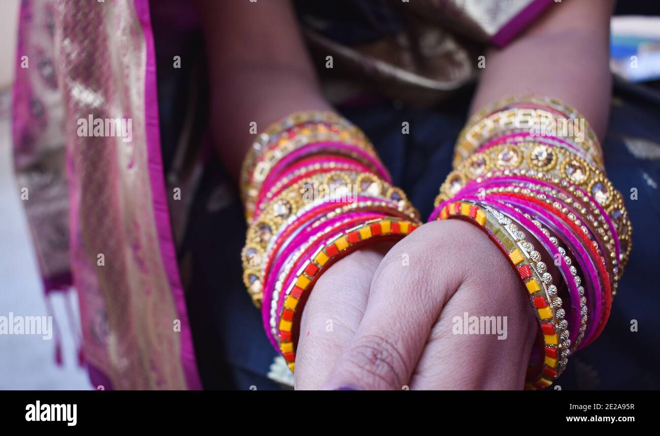 Closeup shot of hands of Indian female wearing colorful bangles Stock ...