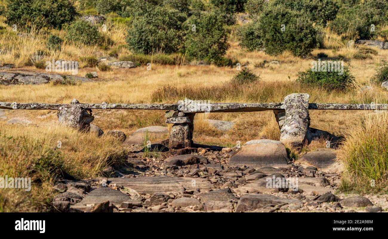 Antique stone boulders bridge over dry river Stock Photo - Alamy